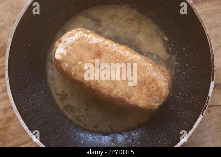 Pan-fried beef meatloaf : flat lay Stock Photo - Alamy