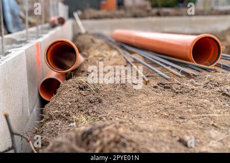plastic pipe for sewage network in the base plate at the construction ...