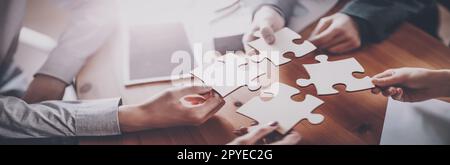 Buisnesswomen and buisnessmen working together while putting together ...