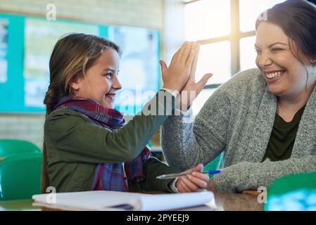 Teacher student high fiving Stock Photo - Alamy