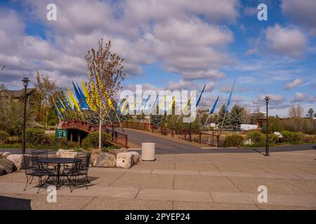 A pedestrian bridge decorated with flags over Deschutes River at the ...