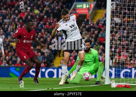Liverpool goalkeeper Alisson Becker saves a back heel from Fulham’s ...