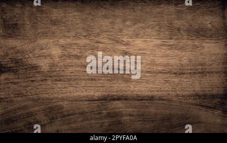 Dark brown rough grainy mango wood texture background Stock Photo - Alamy