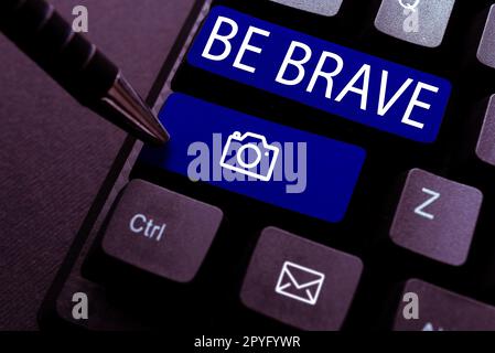 Conceptual caption Be Brave. Word Written on ready to face and endure ...