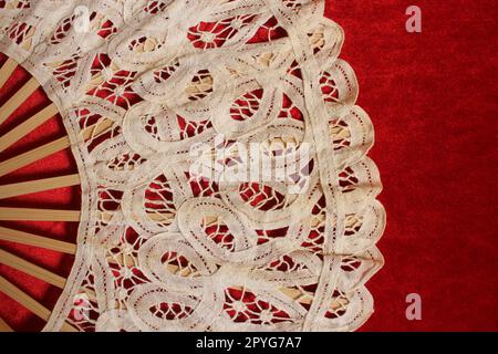 Vintage Lace Hand Fan On Red Velvet Background Stock Photo - Alamy