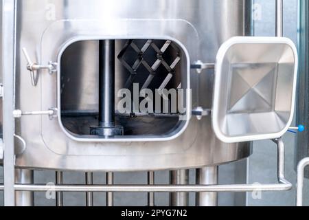 stainless steel boilers and vessels with pipes for brewing beer in a ...