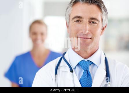 Our patients deserve the best attention. Portrait of a male doctor with ...