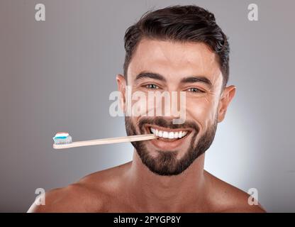 Man, studio and toothbrush for fresh smile, dental and oral hygiene for mature person. Teeth ...