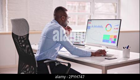 African Businessman Using Analytics Data KPI Dashboard Stock Photo - Alamy