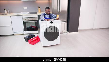 Washing Machine Appliance Repair And Install Stock Photo - Alamy