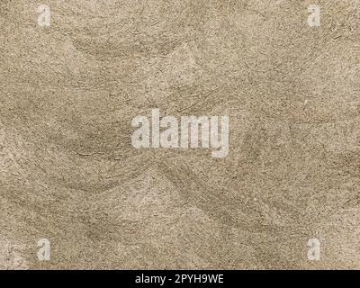 Concrete surface with multi-colored blotches of small stones. Light ...