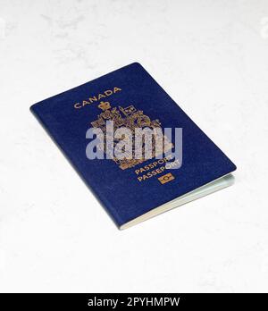 Canadian Passports on a white marble background Stock Photo - Alamy