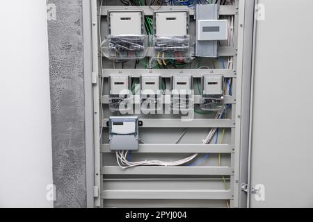 Panel with electric meters and many wires in fuse box Stock Photo - Alamy