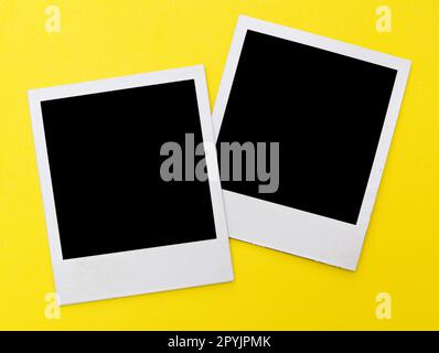 Polaroid photo frames on yellow background Stock Photo - Alamy