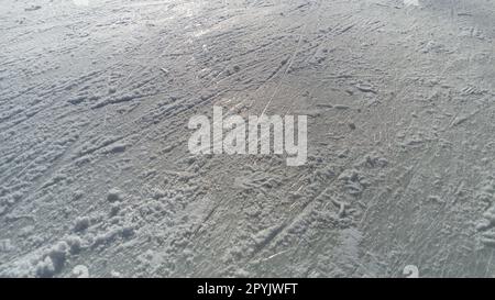 Ice streaked with the tip of figure skates. Figure skating on ice. The ...