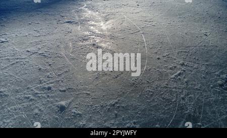 Ice streaked with the tip of figure skates. Figure skating on ice. The ...