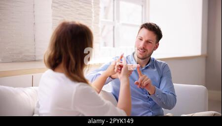 Learning Sign Language. Person With Audiology Disabilities Stock Photo ...