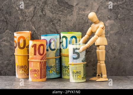 Roll of different fifty euro banknotes, isolated on white with clipping ...