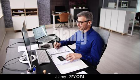 Accounting Bookkeeper Clerk Man. Bank Advisor Stock Photo - Alamy