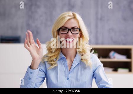 Casual Employee Waving Hello In Video Conference Stock Photo - Alamy