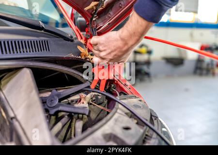 starting the car engine using the starter cable Stock Photo - Alamy