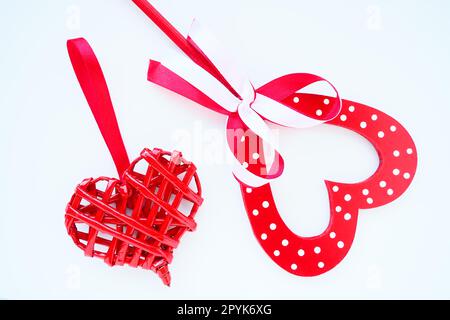 White hearts on a stick with a ribbon, pink background. Valentine's Day ...
