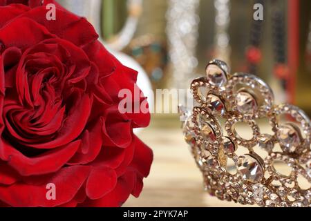 Rose and Tiara with Perfume and Jewelry in Background Shallow DOF Stock ...