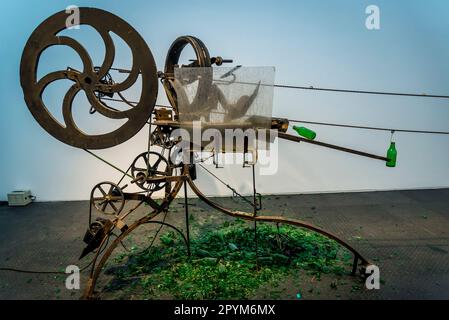 Braking bottles on assembly line, Art in Protest, Destructive action as ...