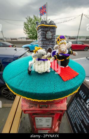 Colourful knitted post box topper celebrating the Paris 2024 Olympics ...