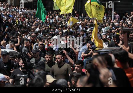 Mourners attend the funeral of three members of the Gershovich family ...