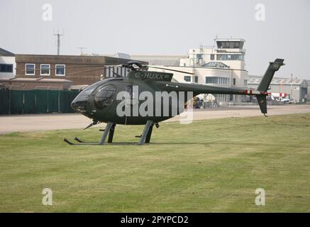 An MD Helicopters 369E departing Brighton City Airport West Sussex ...