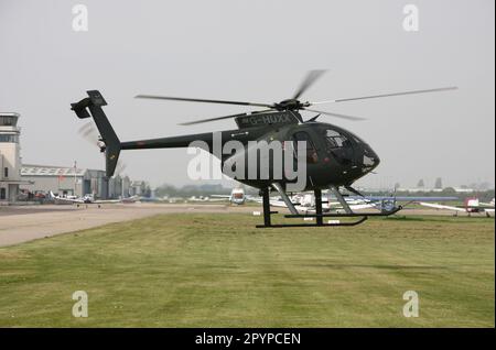 An MD Helicopters 369E departing Brighton City Airport West Sussex ...