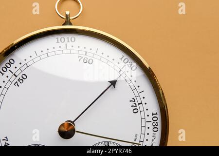 Aneroid barometer on brown background Stock Photo - Alamy