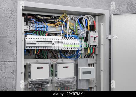 Panel with electric meters and many wires in fuse box Stock Photo - Alamy