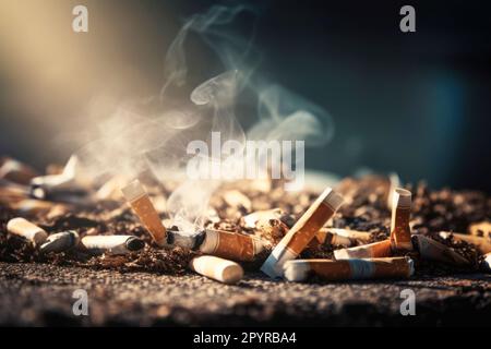 A pile of extinguished and crumpled cigarettes, cigarette burning and ...