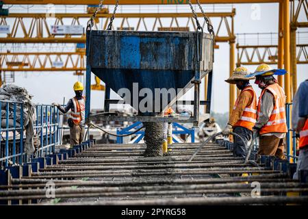 Kota Bharu, Malaysia. 26th Apr, 2023. Employees work at a beam yard of ...