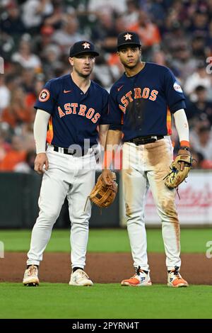 Houston Astros shortstop Alex Bregman throws to first for the out after ...