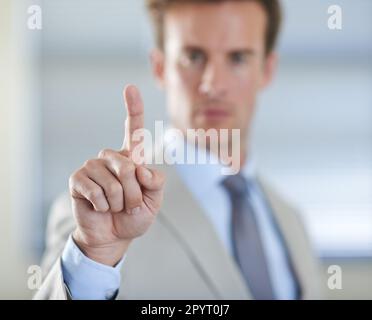 Businessman using digital interface with his fingers Stock Photo - Alamy