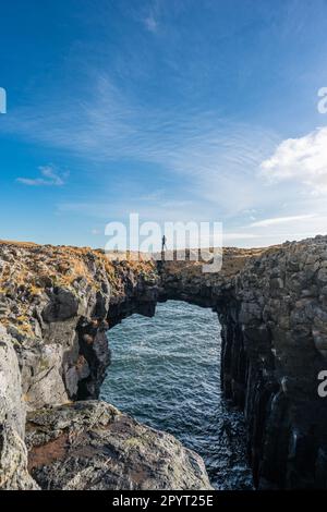 The natural stone bridge at Arnarstapi on Snæfellsnes Peninsula in ...