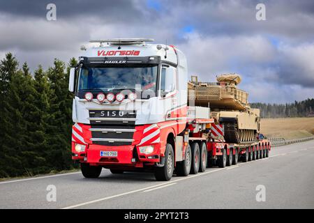 Sisu Polar Hauler truck hauls American M1 Abrams military tank on low ...