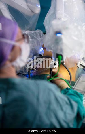 Doctor assists during a modern hybrid surgery, 3D innovative technology ...