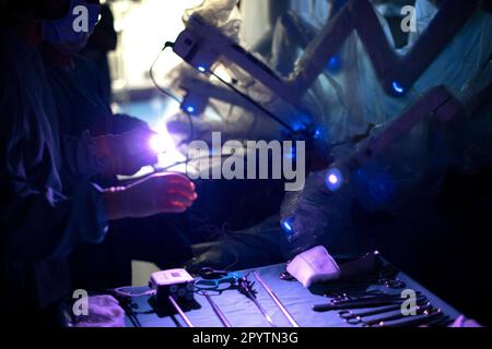 Doctor assists during a modern hybrid surgery, 3D innovative technology ...