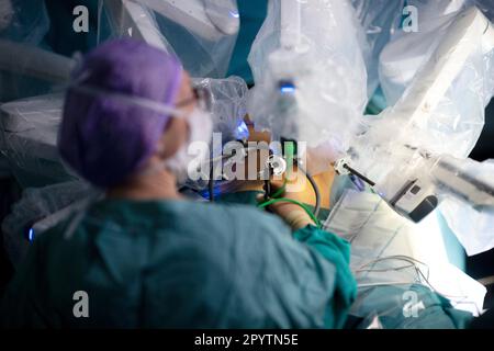 Doctor assists during a modern hybrid surgery, 3D innovative technology ...