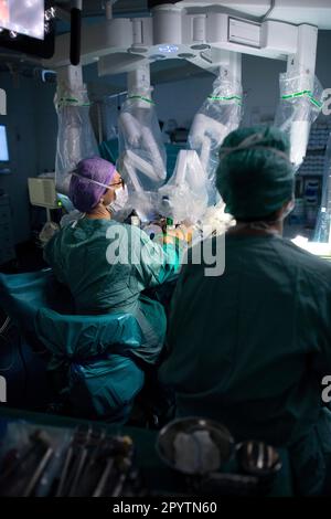 Doctor assists during a modern hybrid surgery, 3D innovative technology ...