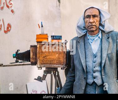 A street scene in Baghdad, Iraq, near the Katah Bridge, showcasing ...
