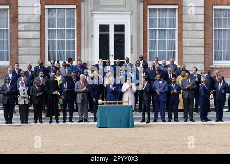 King Charles III (centre) poses for a photograph with faith leaders at Buckingham Palace, London ...