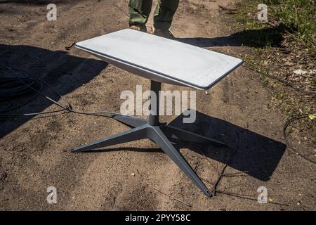 Ukrainian soldier using Starlink, a satellite internet constellation ...