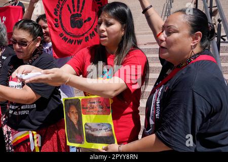 Nickie Saunders, center, of Tecumseh, Okla., releases a butterfly ...
