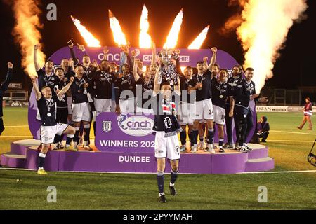 Dundee's Cammy Kerr celebrates lifting the trophy with team-mates after ...