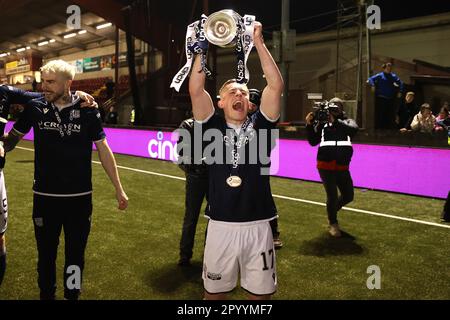 Dundee's Luke McCowan celebrates with the trophy after winning the ...